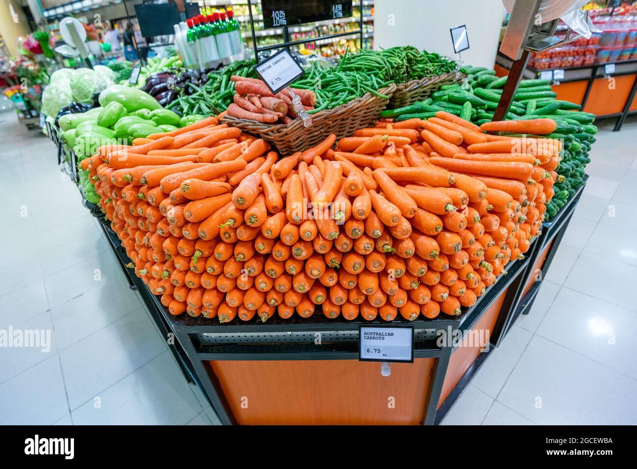 Harvest of ripe carrots on the shelves of vegetable food department in ...