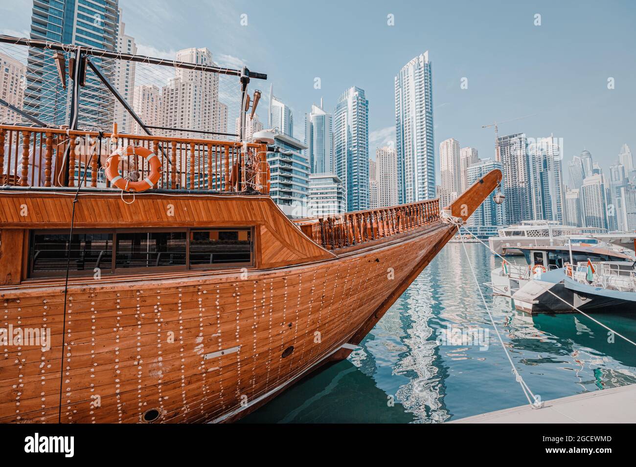 Wooden ferry boat or tourist cruise ship in Dubai Marina Stock Photo ...