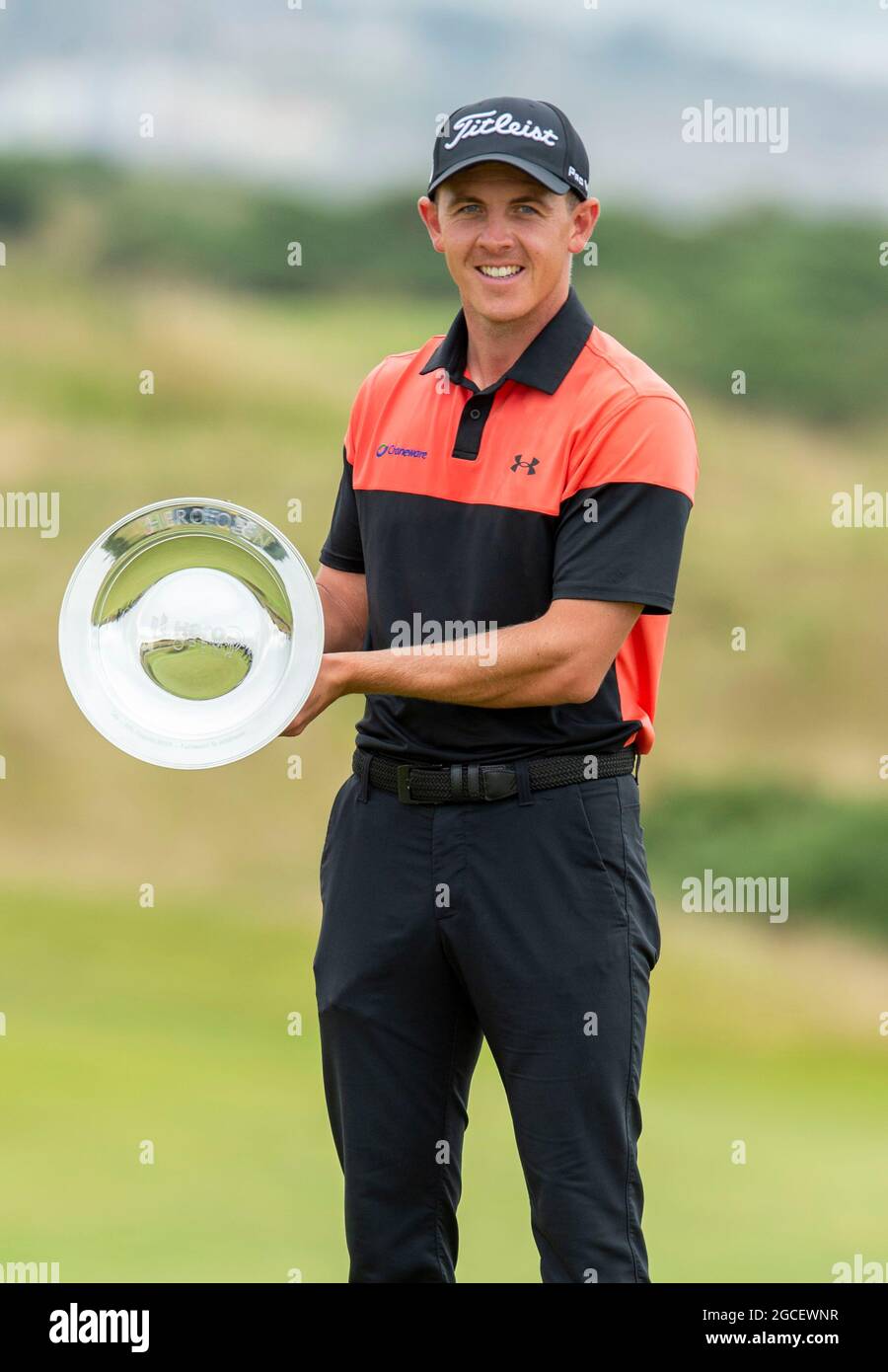 ScotlandÕs Grant Forrest holds the trophy on the 18th after winning the ...