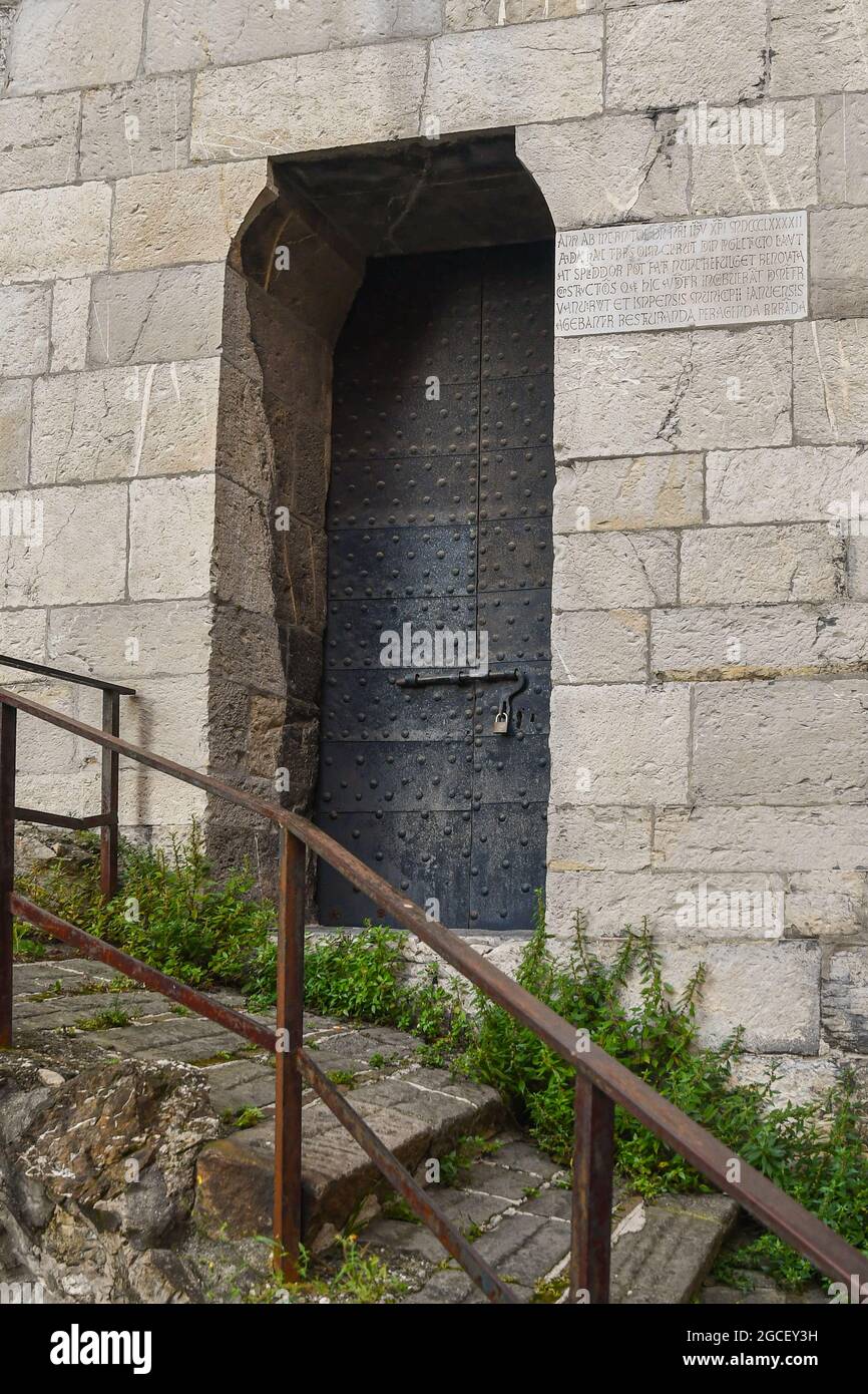 Studded entrance door of one of the towers of Porta Soprana, medieval ...