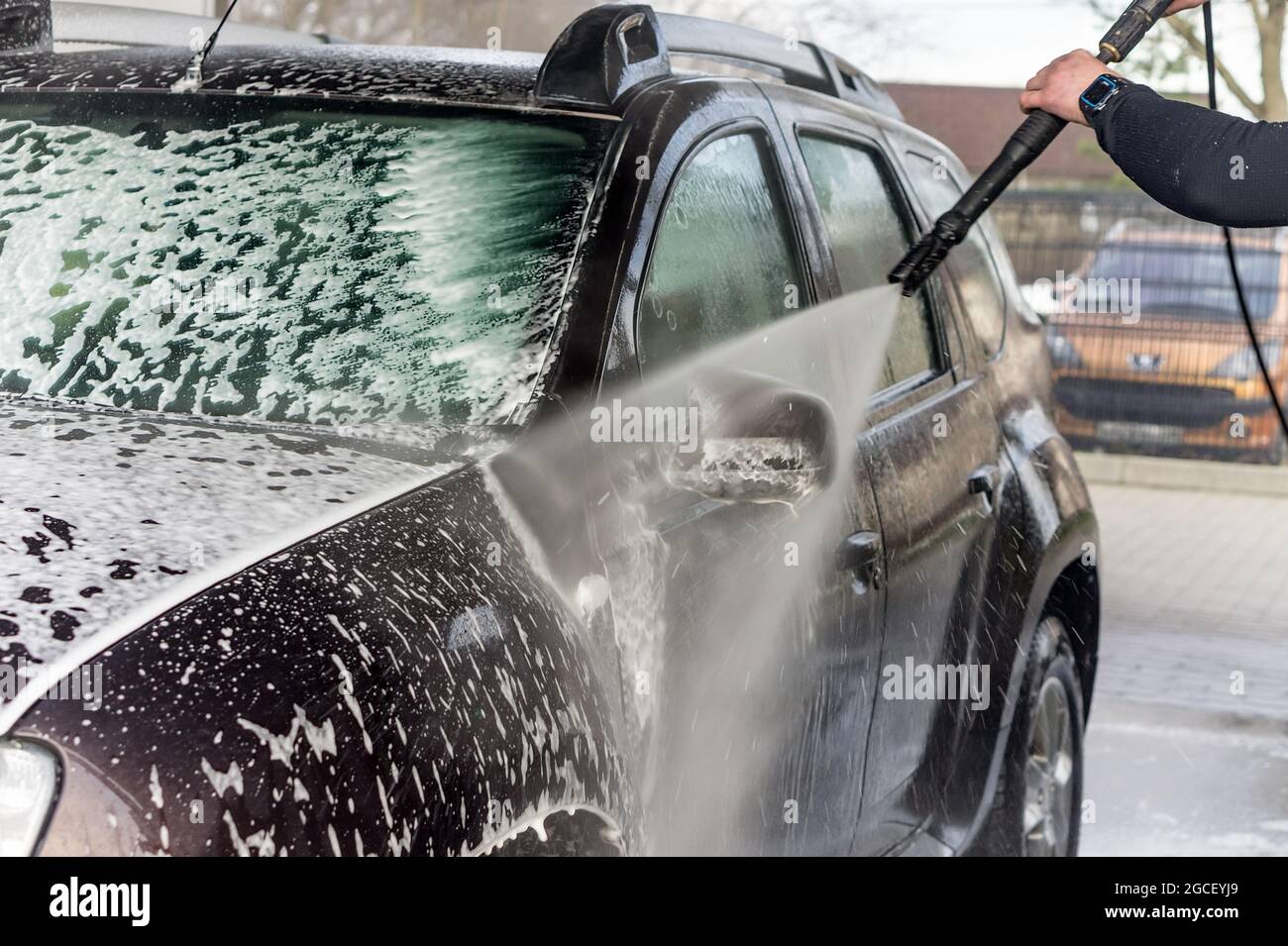 Kaliningrad, Russia, March 1, 2020. A man washes his car at a touchless ...