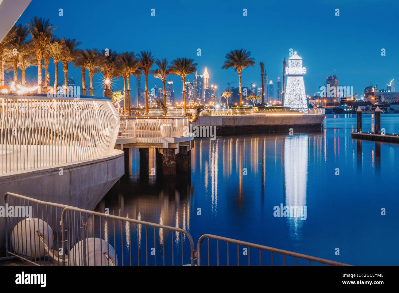 Illuminated decorative lighthouse near the parking lot of yachts and ...