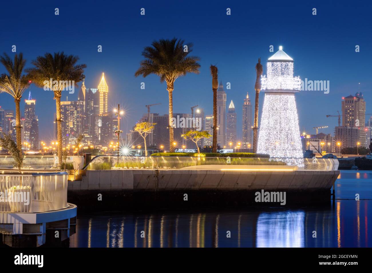 Illuminated decorative lighthouse near the parking lot of yachts and ...