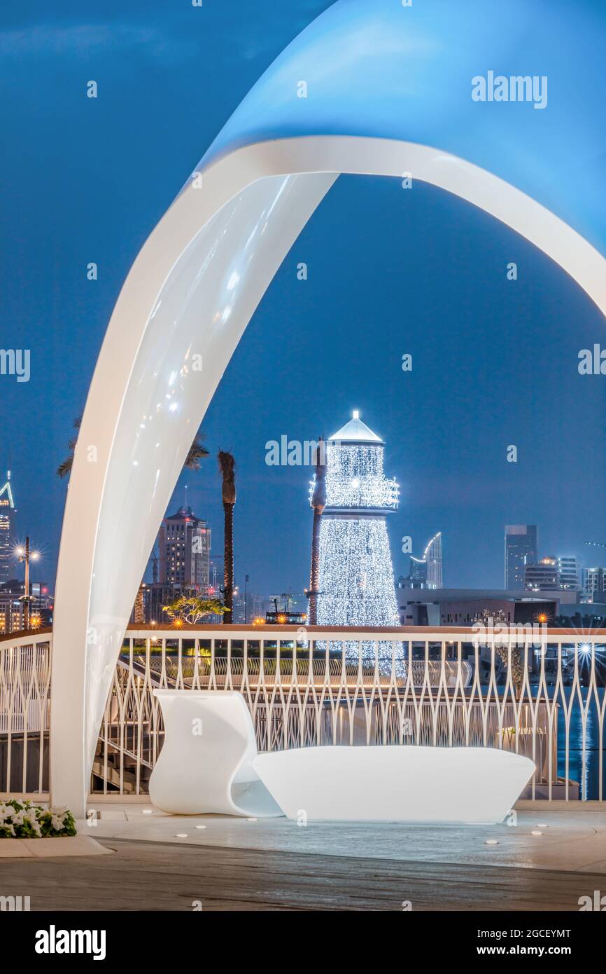 Illuminated decorative lighthouse near the parking lot of yachts and ...