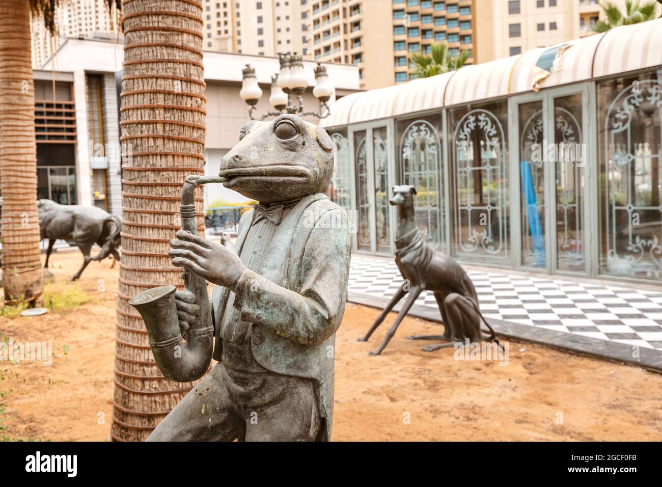 25 February 2021, Dubai, UAE: A statue of a frog in a suit playing jazz ...