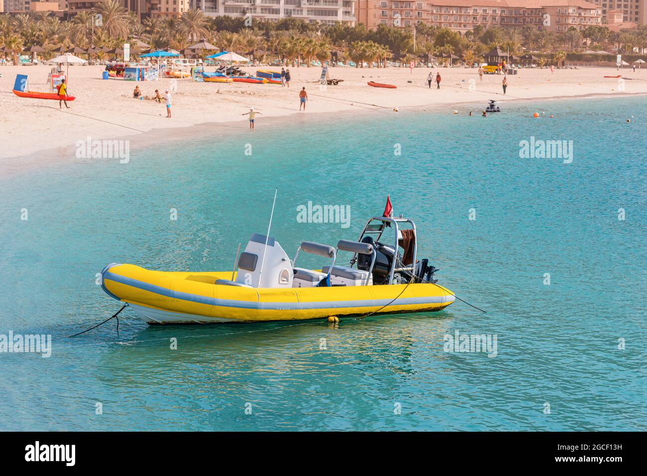 Yellow speedboat awaits tourists for tours and excursions around the ...
