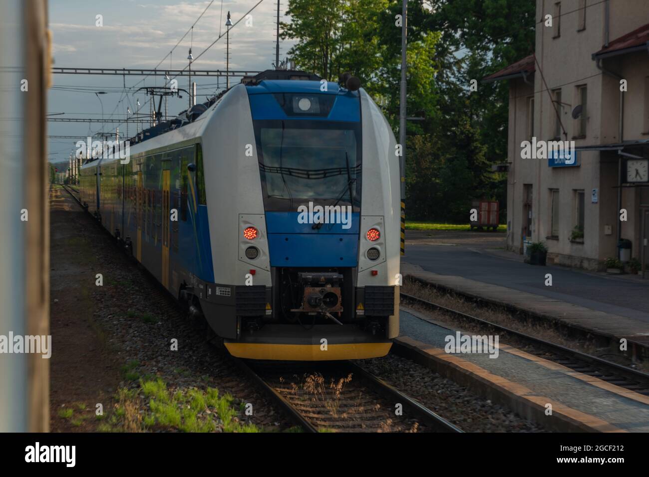 Blue czech trains near in Plzen town area in sunrise morning color time Stock Photo - Alamy