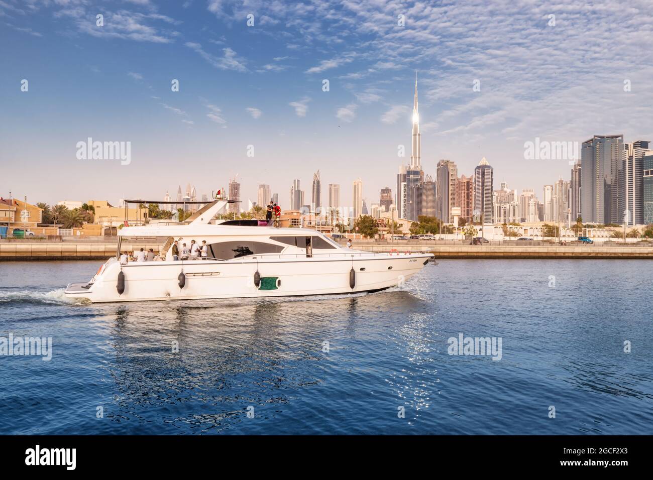 23 February 2021, Dubai, UAE: Luxury yacht or boat sails by Dubai Creek ...