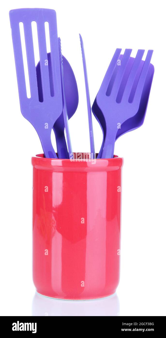 Plastic kitchen utensils in cup isolated on white Stock Photo - Alamy
