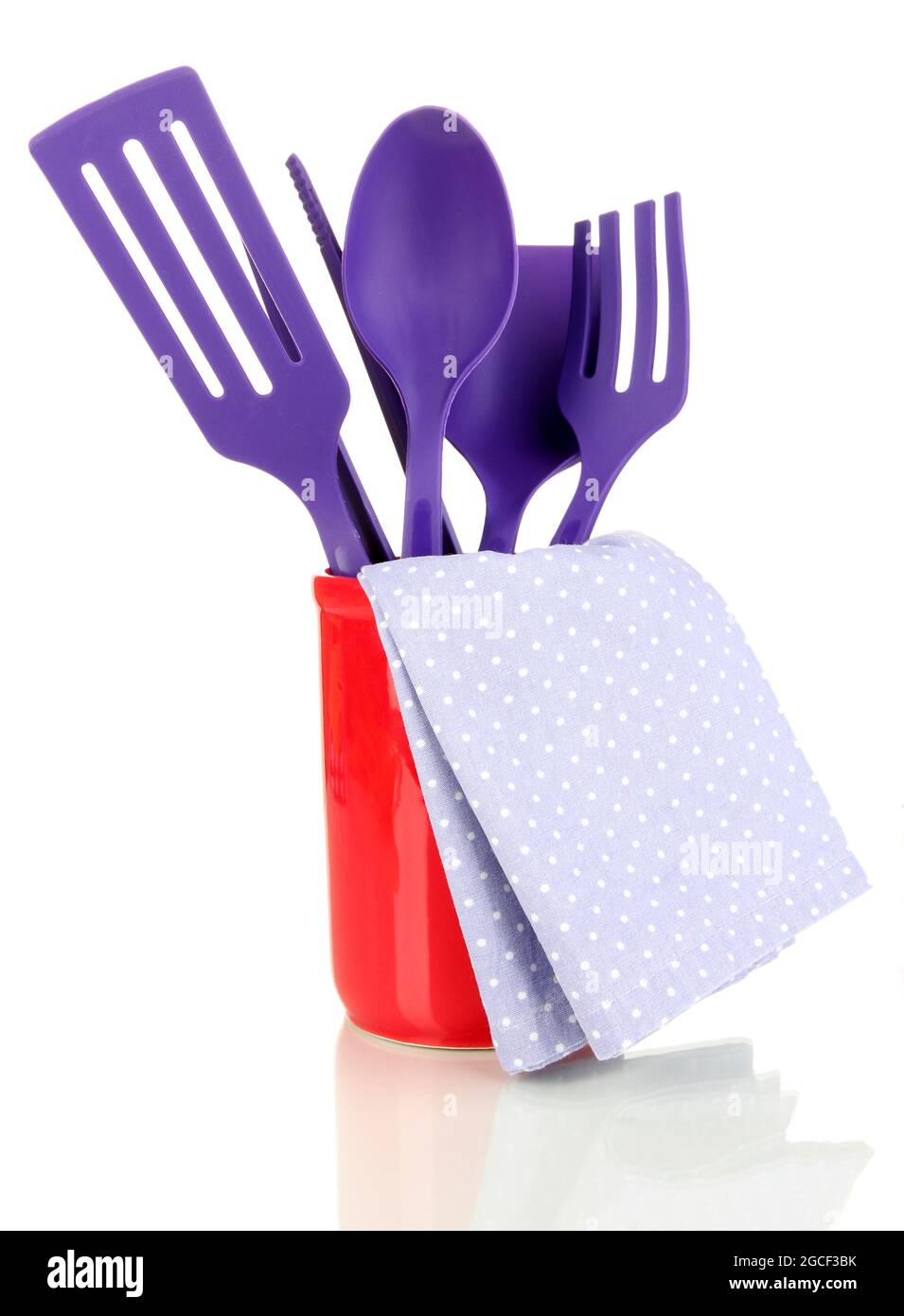 Plastic kitchen utensils in cup isolated on white Stock Photo - Alamy
