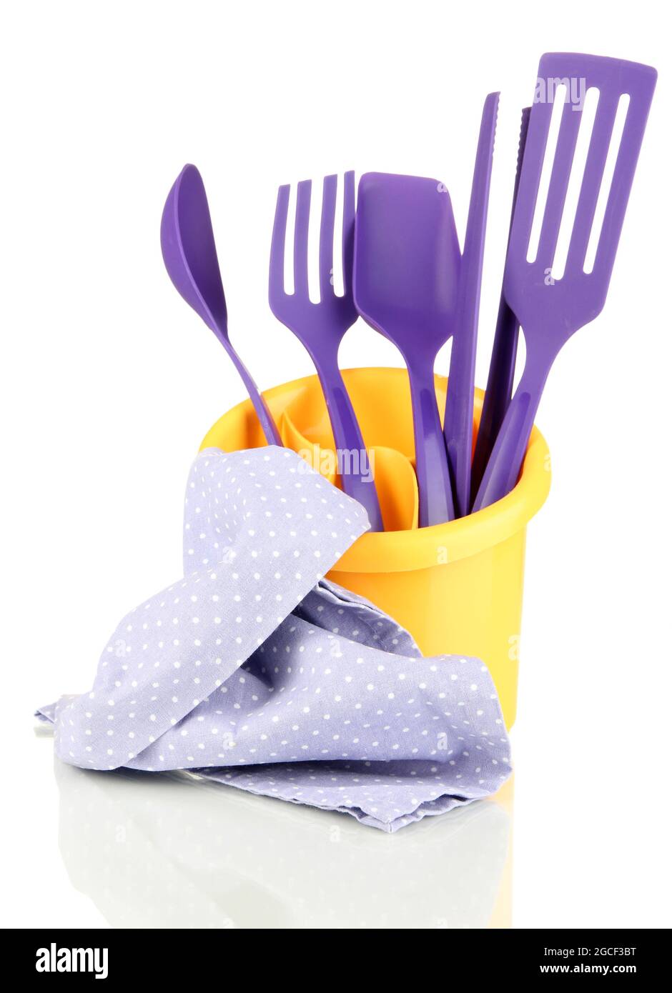Plastic kitchen utensils in cup isolated on white Stock Photo - Alamy