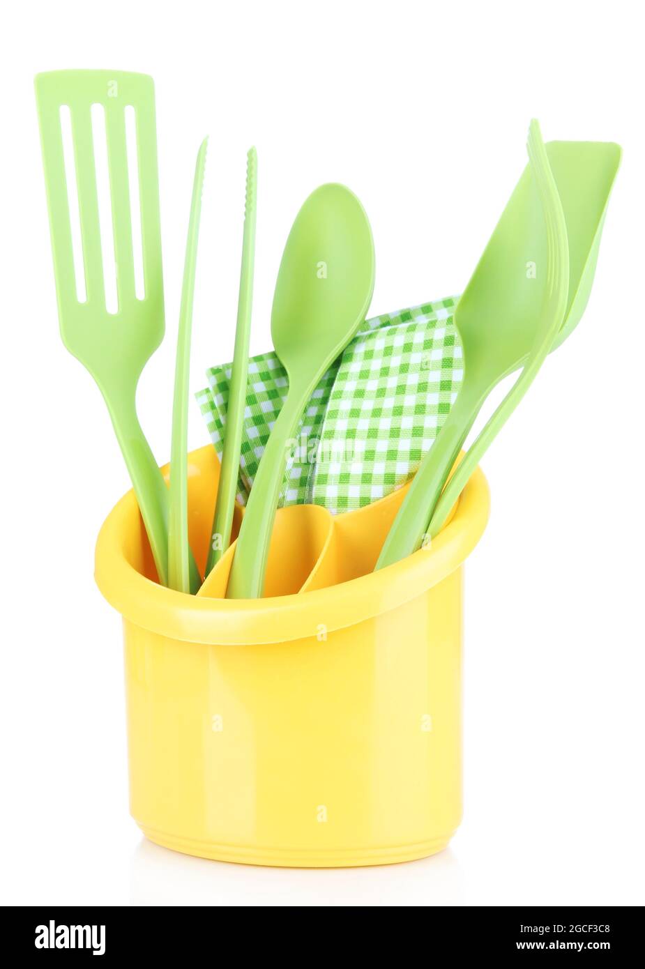 Plastic kitchen utensils in cup isolated on white Stock Photo - Alamy