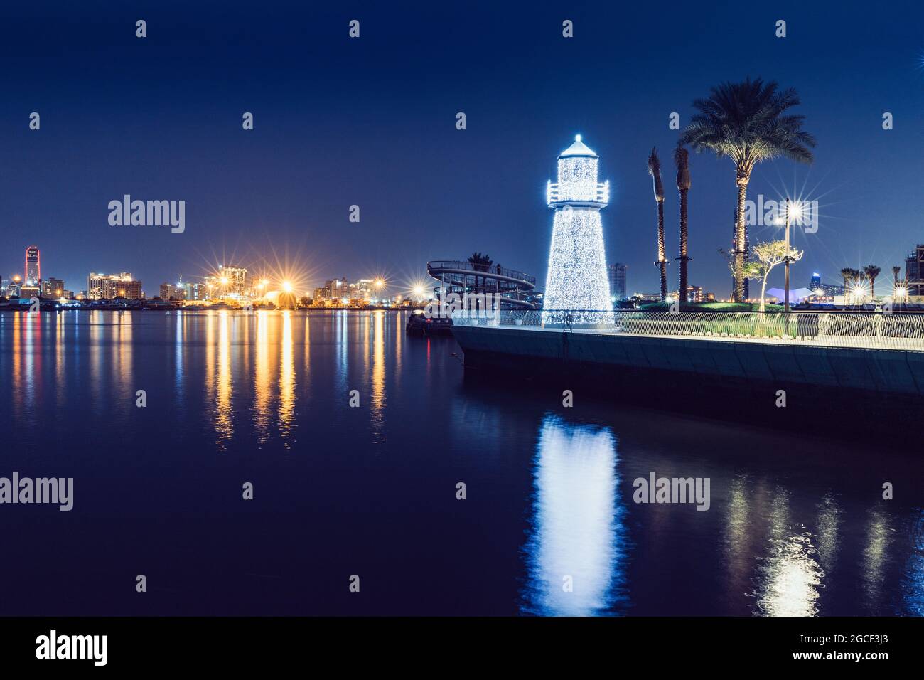 Illuminated decorative lighthouse near the parking lot of yachts and ...