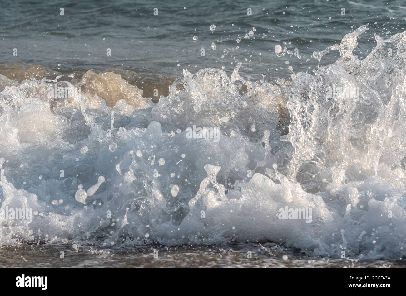 wave splash sea beach macro, close up Stock Photo - Alamy