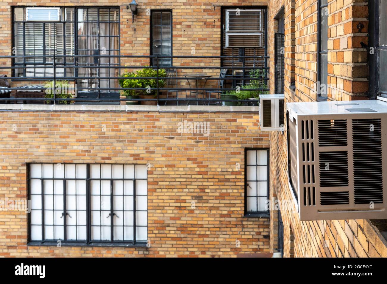 Window mounted air conditioners are used in New York City buildings ...