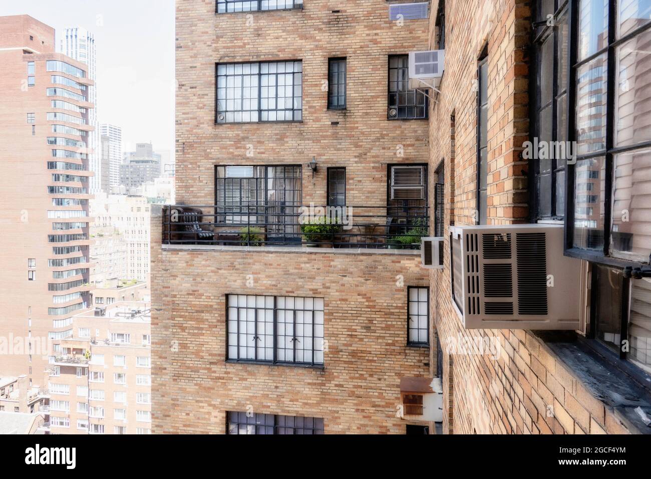 Window mounted air conditioners are used in New York City buildings ...