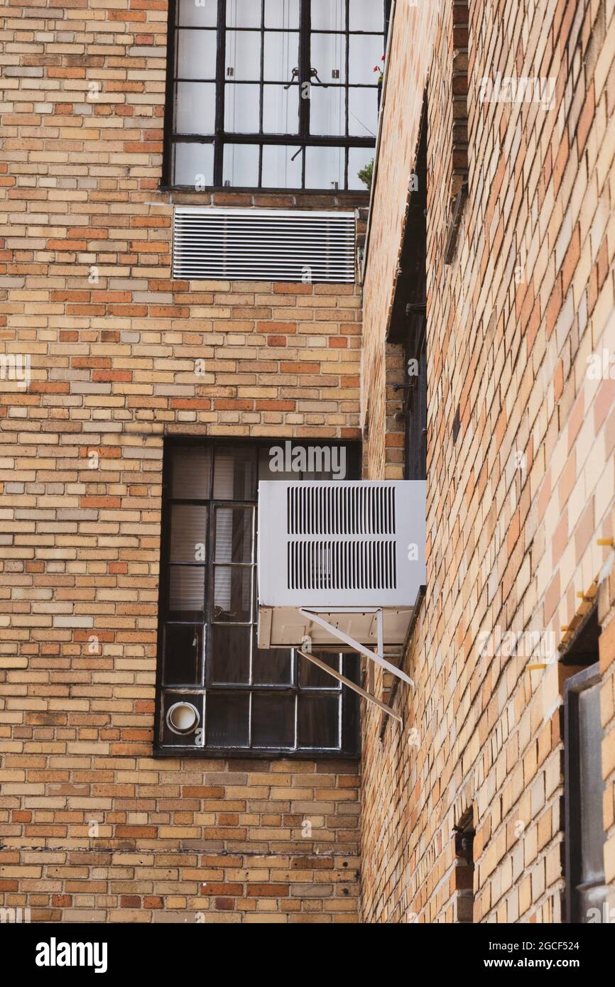 Window mounted air conditioners are used in New York City buildings ...