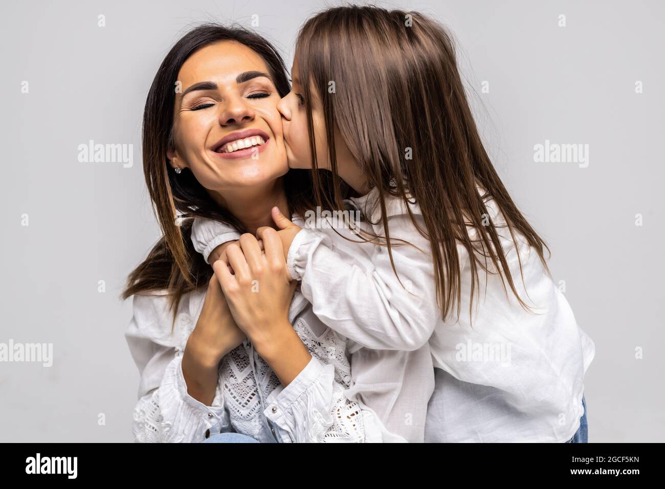 Mother kissing daughter isolated on hi-res stock photography and images ...
