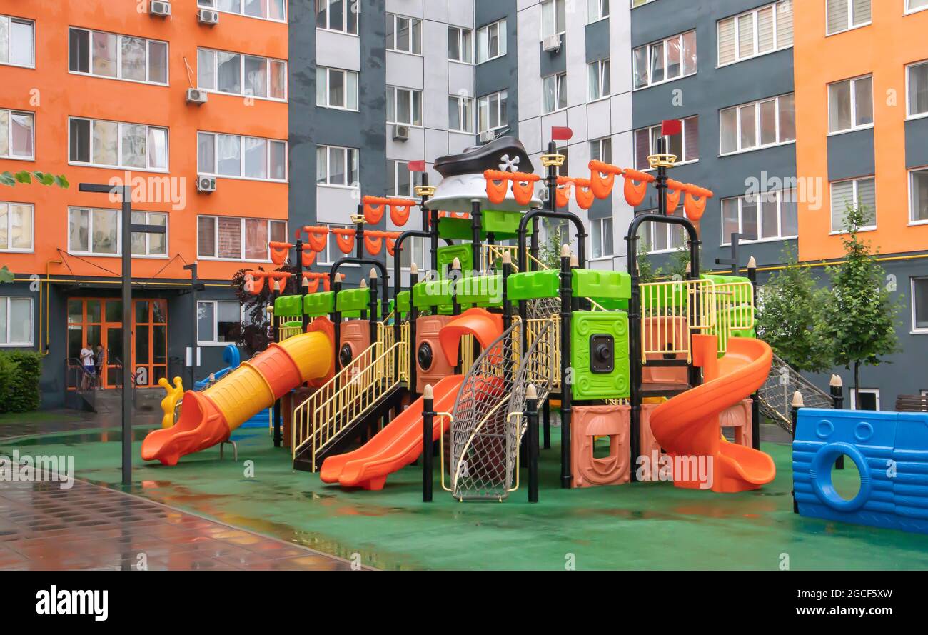 A courtyard of high-rise buildings with a new modern colorful and large ...