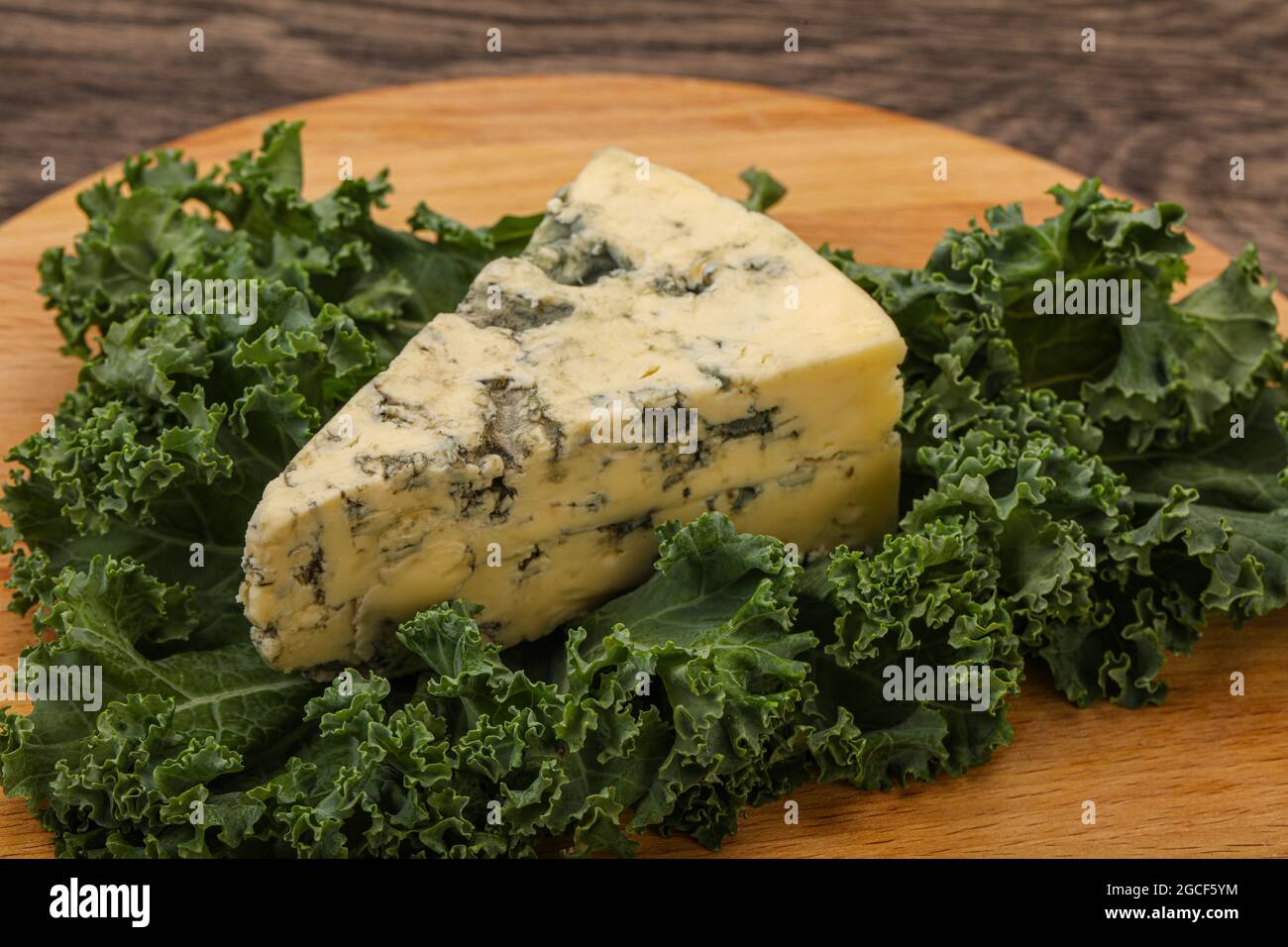 Dairy Blue cheese triangle with mold Stock Photo - Alamy