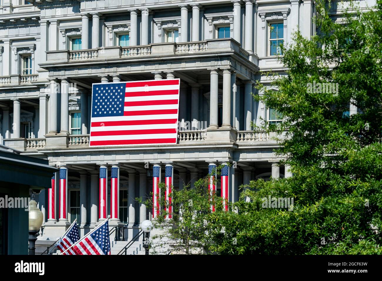 American flags are seen on the exterior of the Eisenhower Executive ...