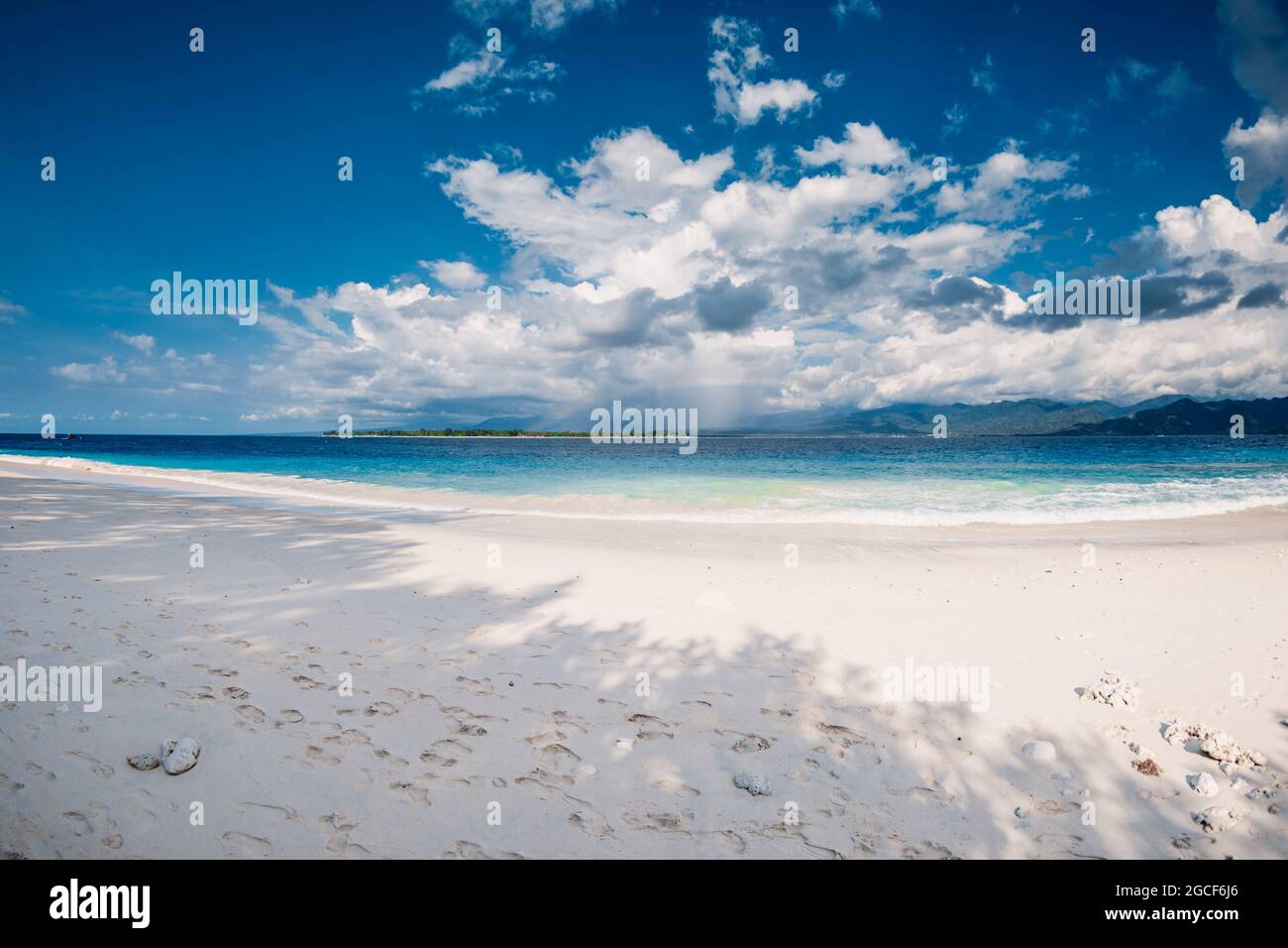 Tropical beach and blue ocean in tropics Stock Photo - Alamy