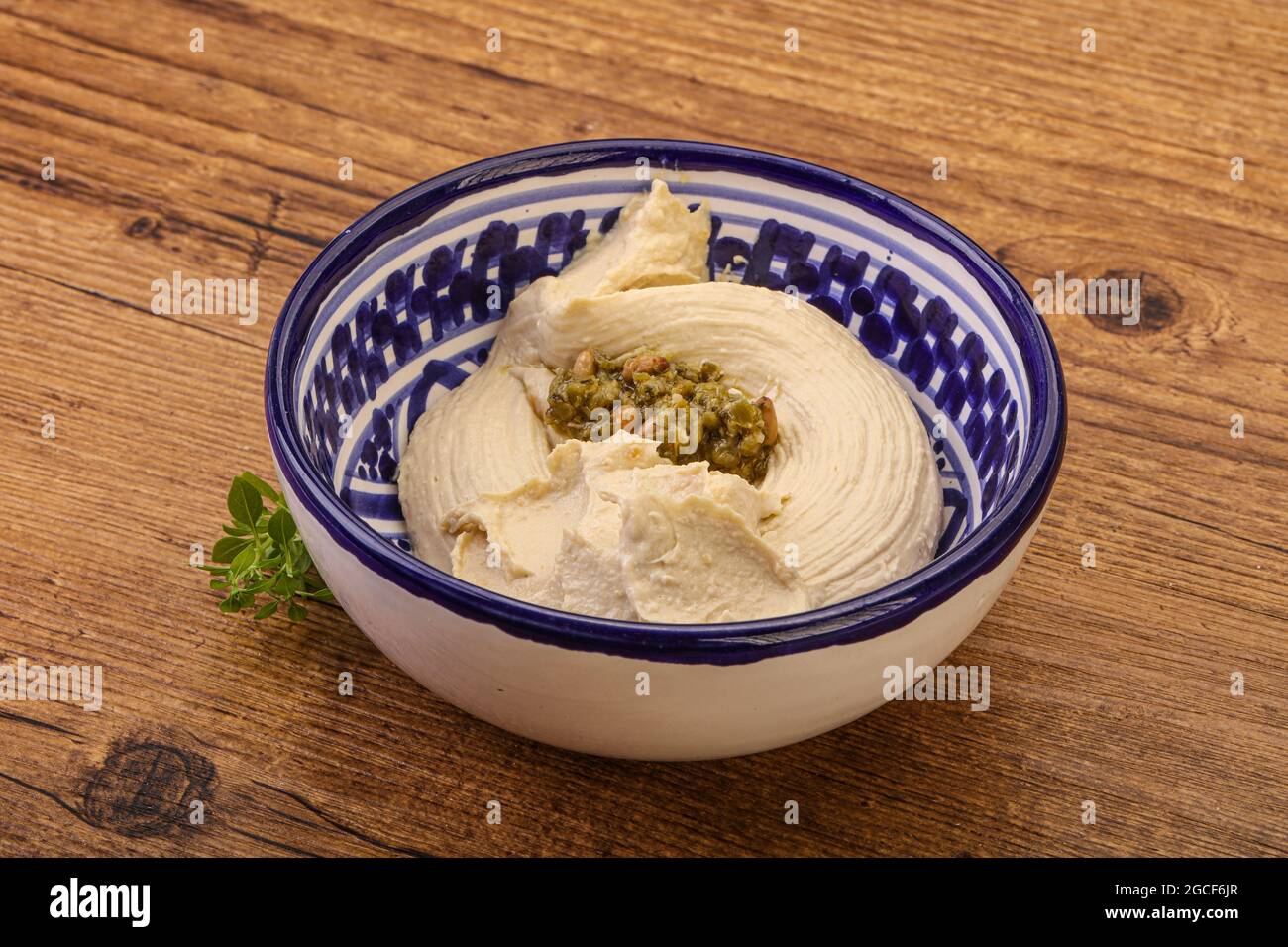 Vegan food - hummus dip with olive oil Stock Photo - Alamy