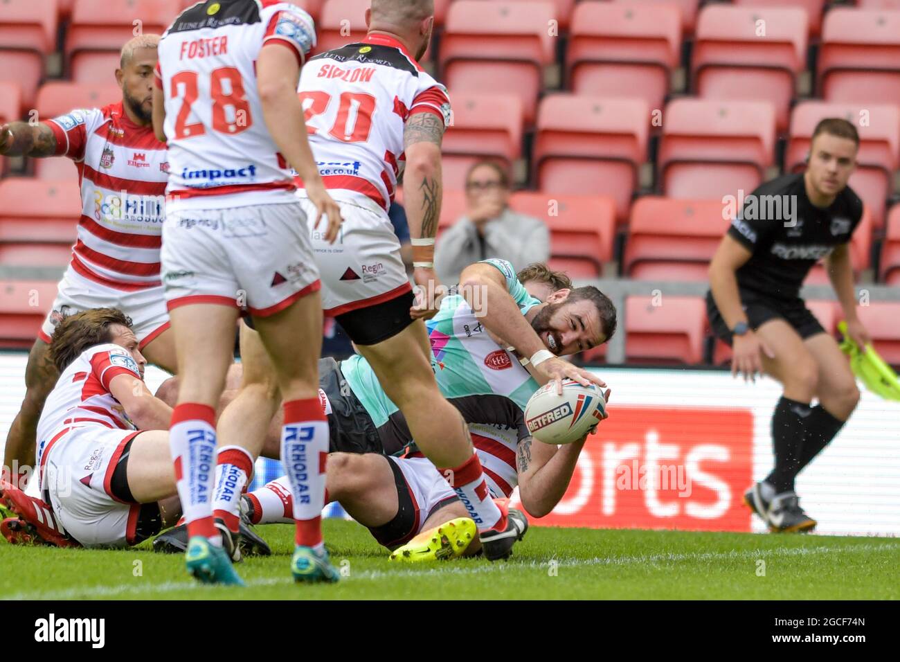 Kane Linnett (12) of Hull KR goes close to scoring a try but the Leigh ...