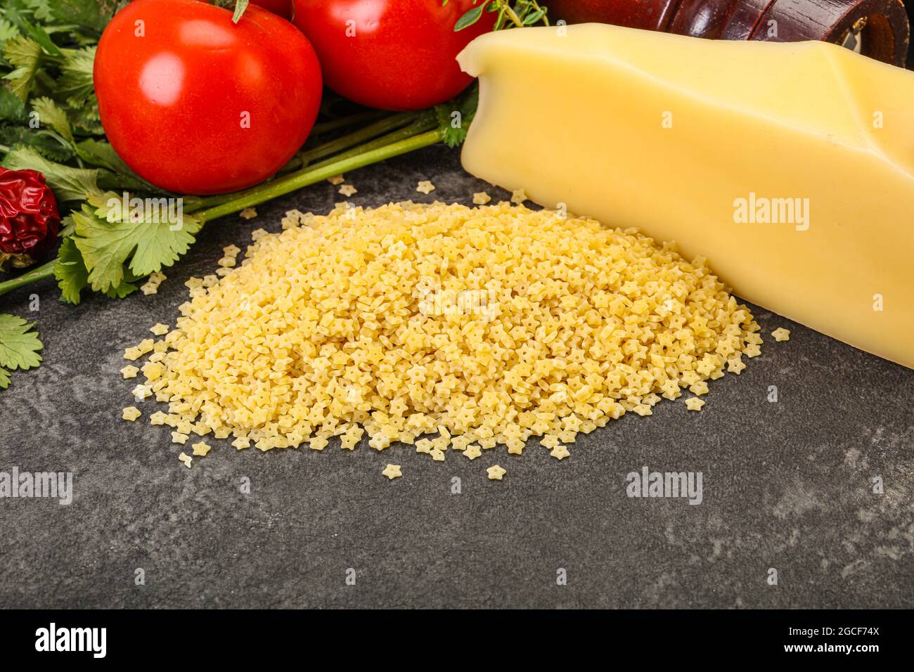 Raw Italian pasta - Stelline for cooking served vegetables Stock Photo ...