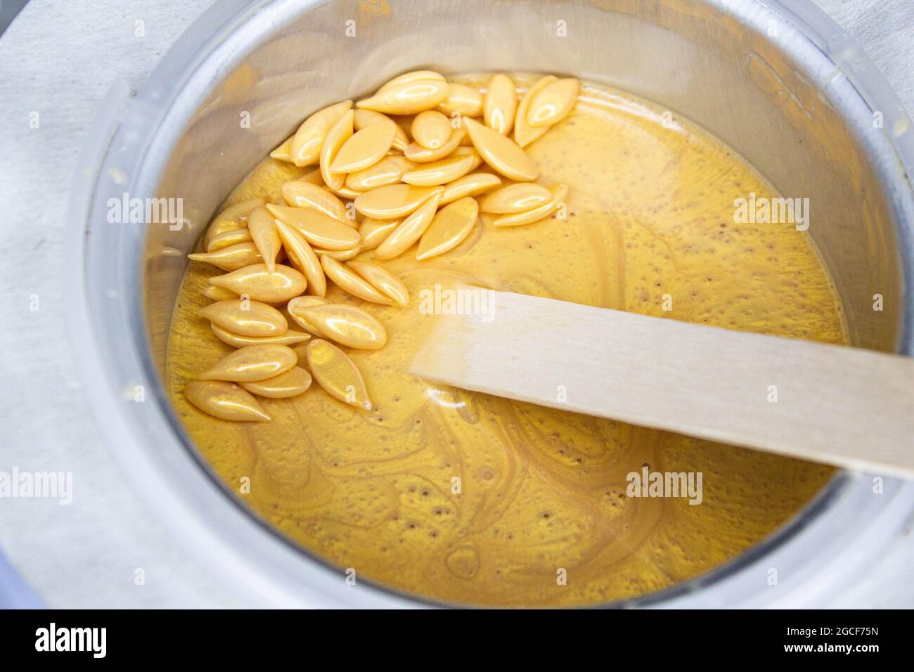 Waxing granules hi-res stock photography and images - Alamy