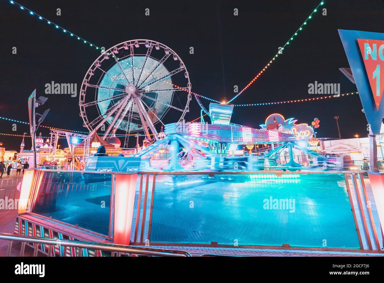 26 February 2021, UAE, Dubai: Amusement park with big ferris wheel in ...