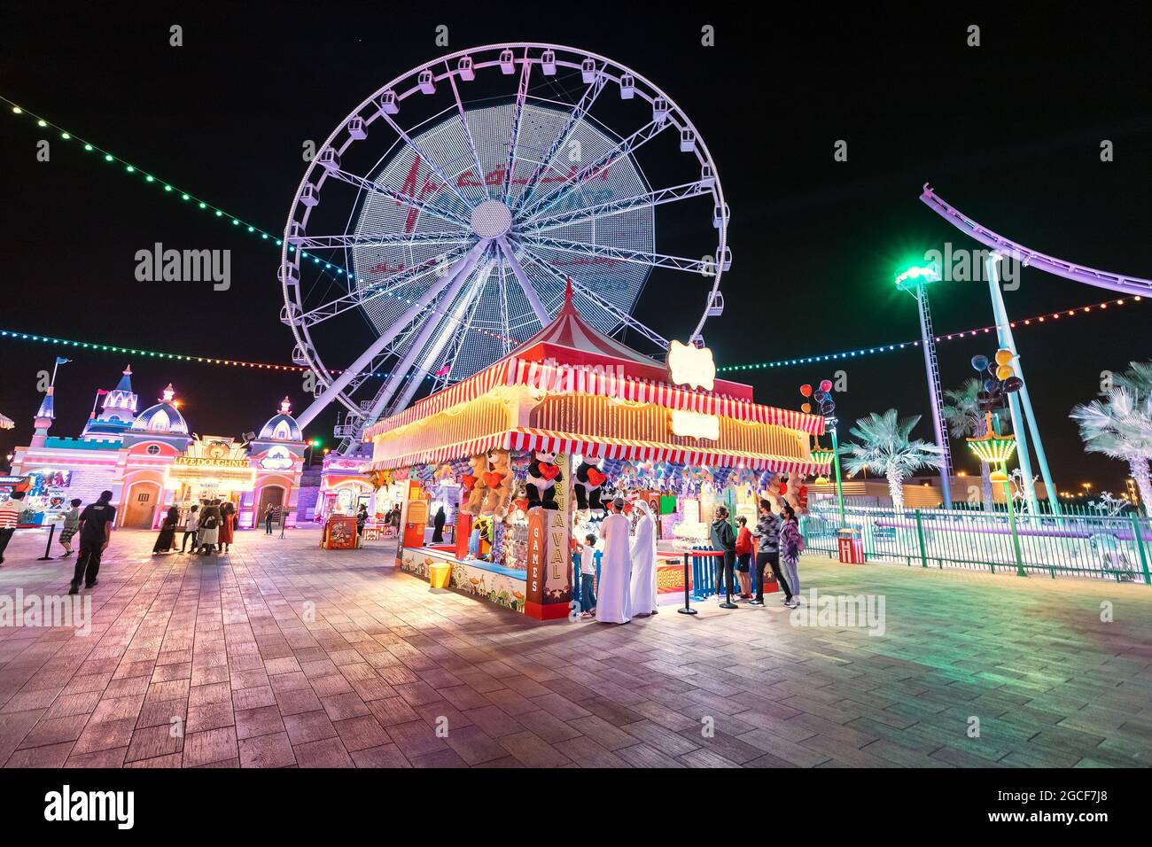 26 February 2021, UAE, Dubai: Amusement park with big ferris wheel in ...