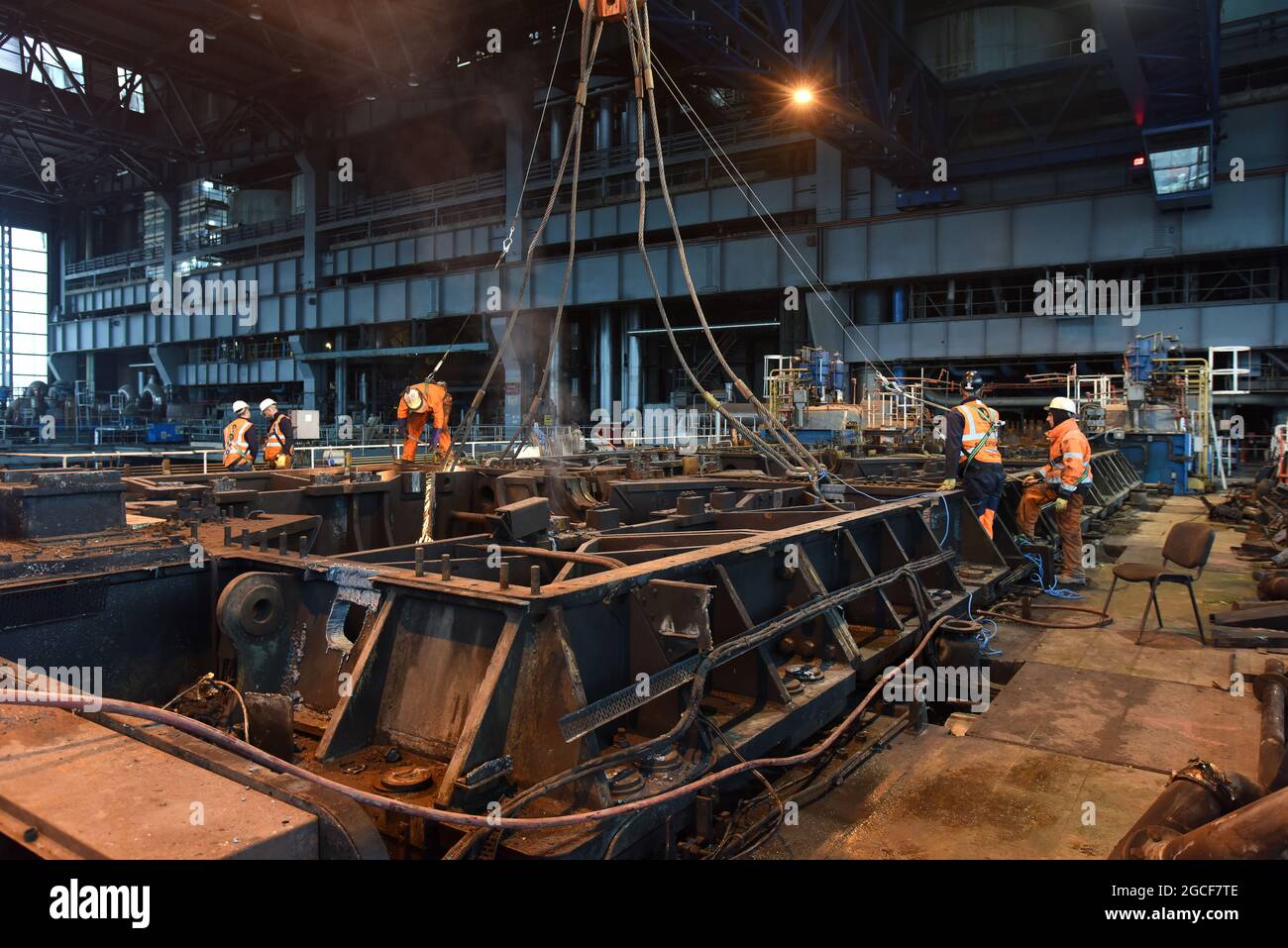 Demolition workers cutting iron and steel using acetylene torch in the ...