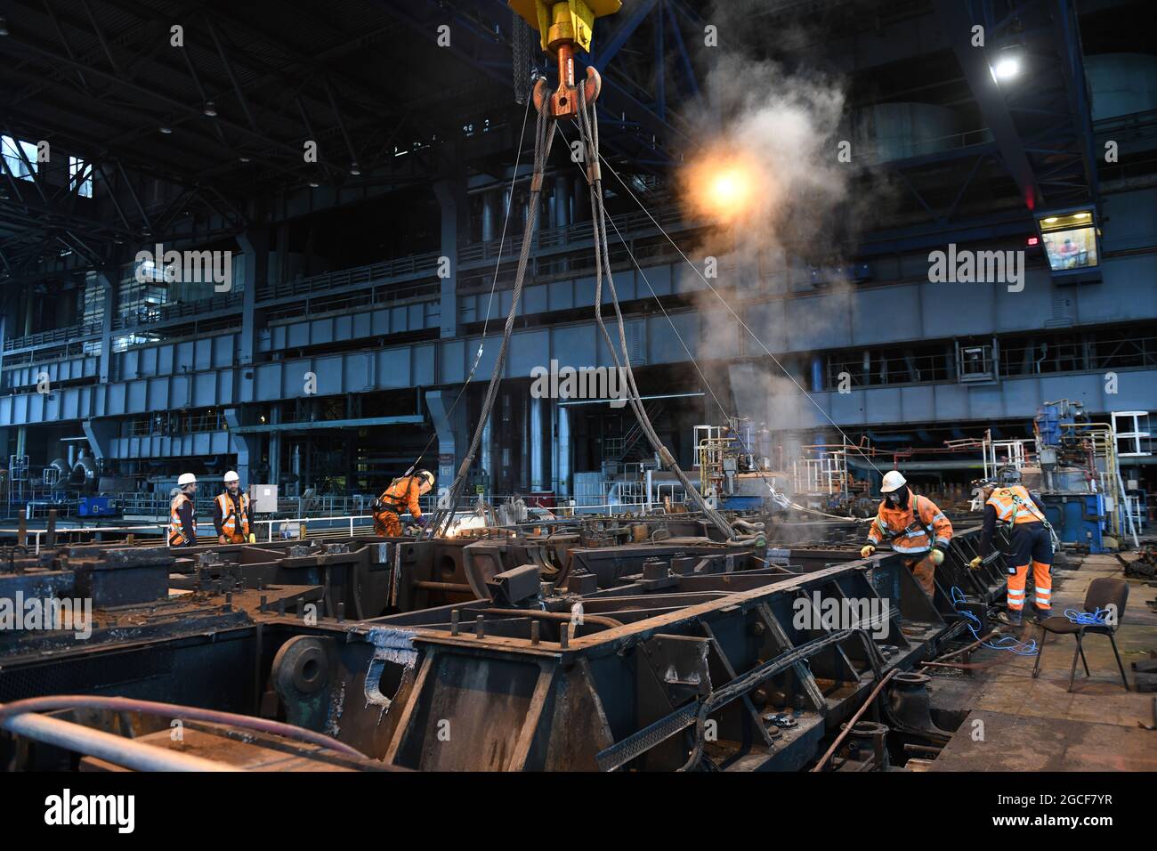 Demolition workers cutting iron and steel using acetylene torch in the ...