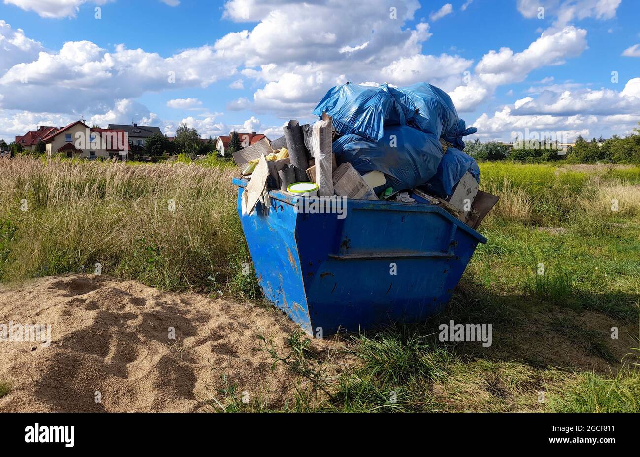 Container full of garbage, construction waste. Environment pollution ...