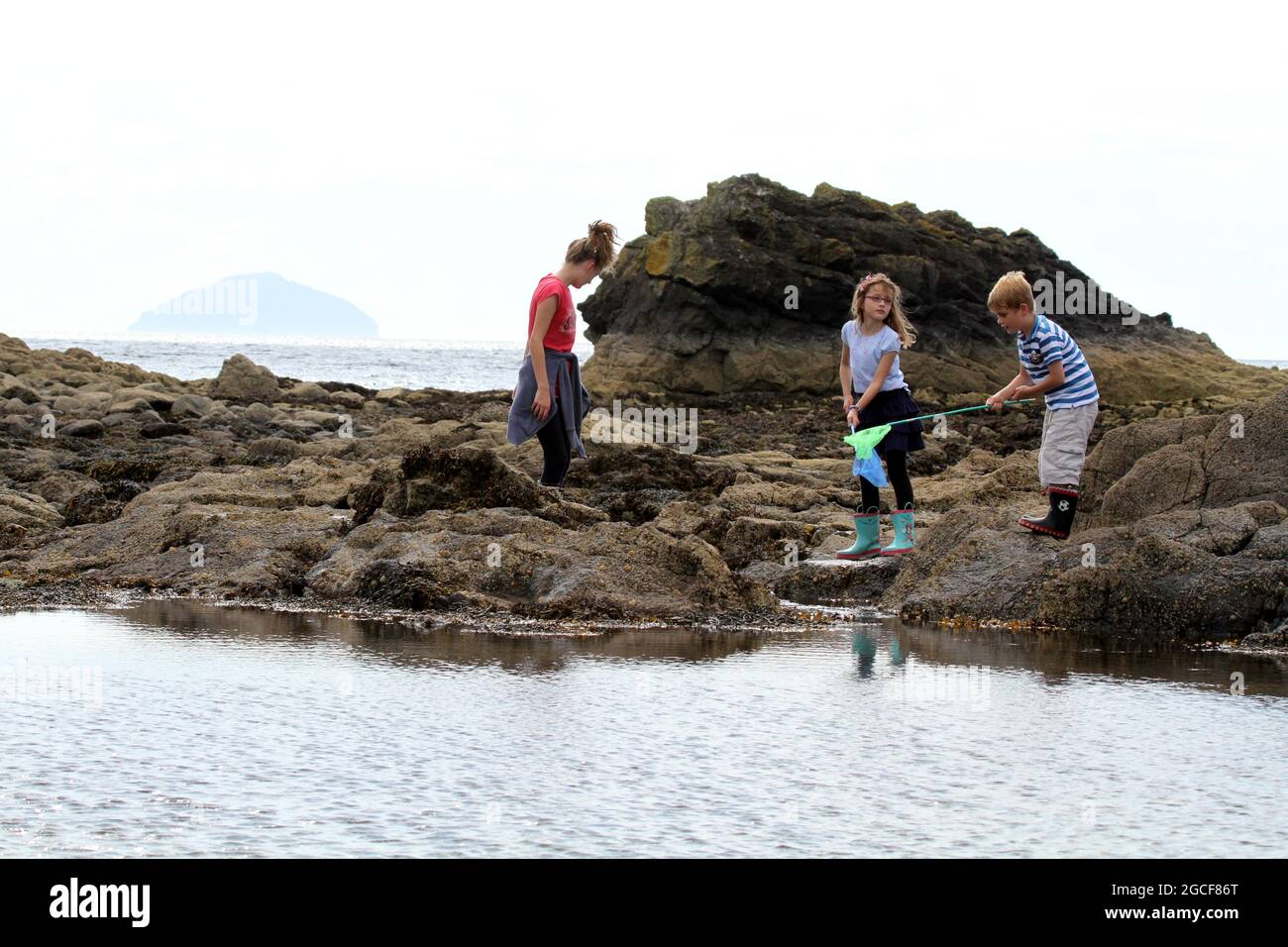 Ayrshire Carrick Dunure Children rockpooling Stock Photo - Alamy