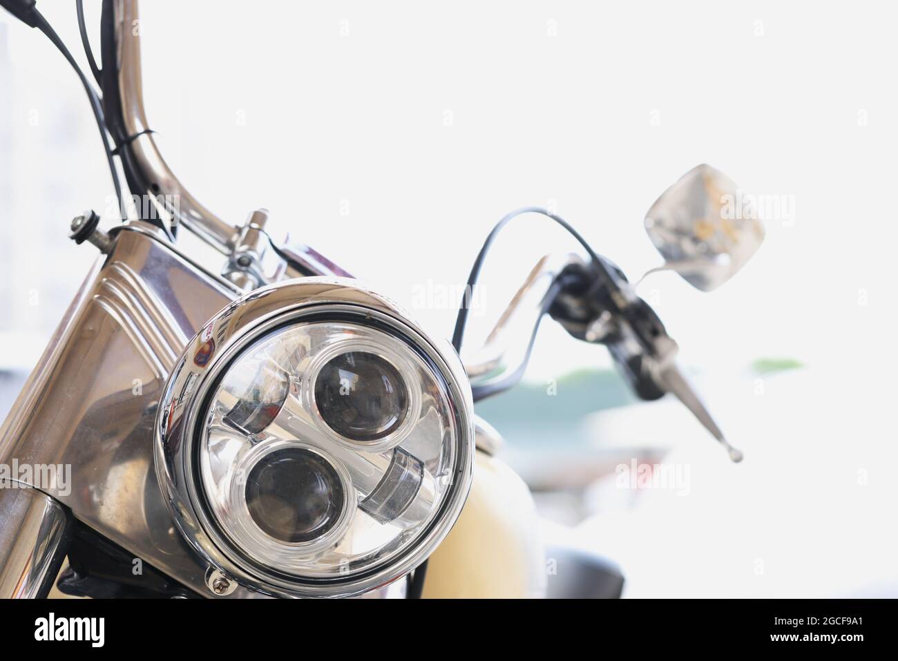 Round motorcycle headlight with handlebars and mirrors closeup Stock ...