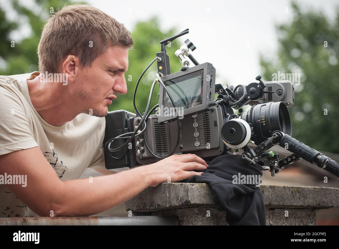 Behind the scene. Cameraman shooting the film scene with his camera on ...