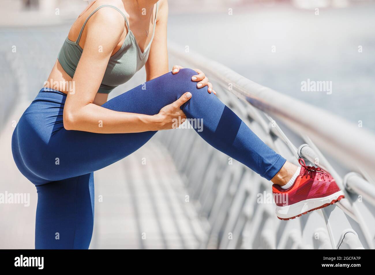 Young woman was running along the embankment and suddenly felt a sharp ...