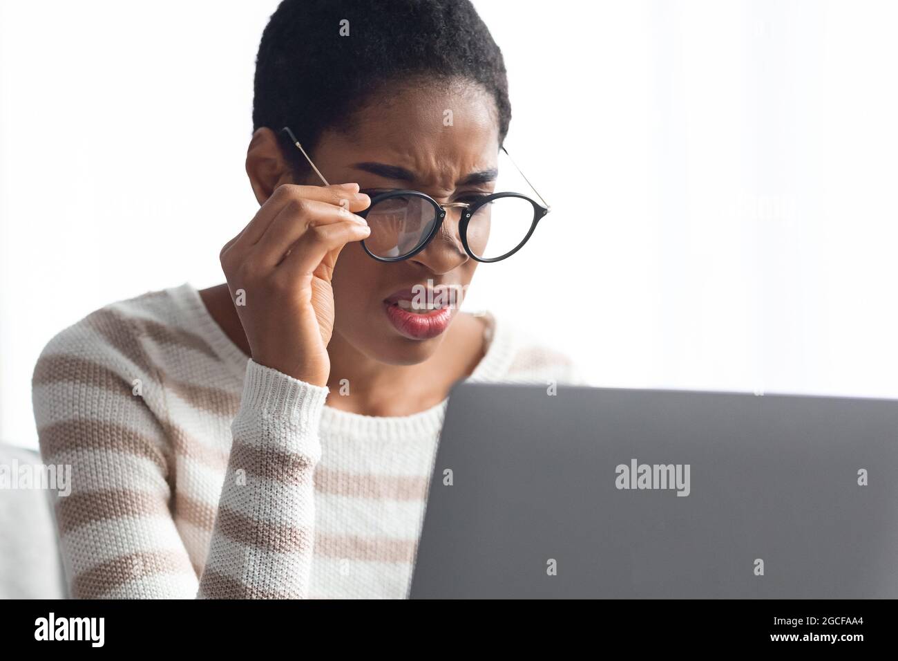 Poor Eyesight Concept. African American Lady In Eyeglasses Looking At ...
