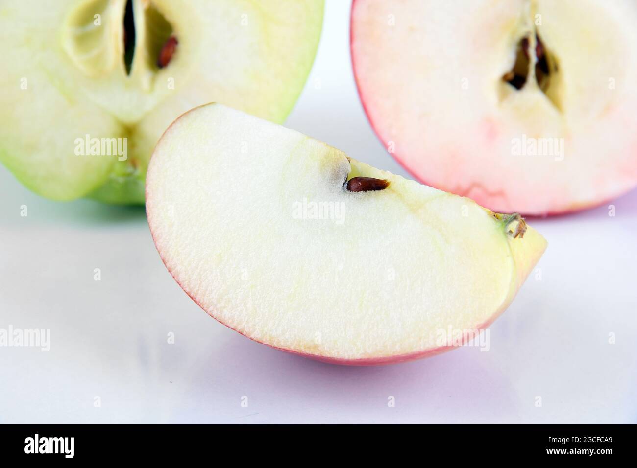 Sweet cut apples isolated on white Stock Photo - Alamy