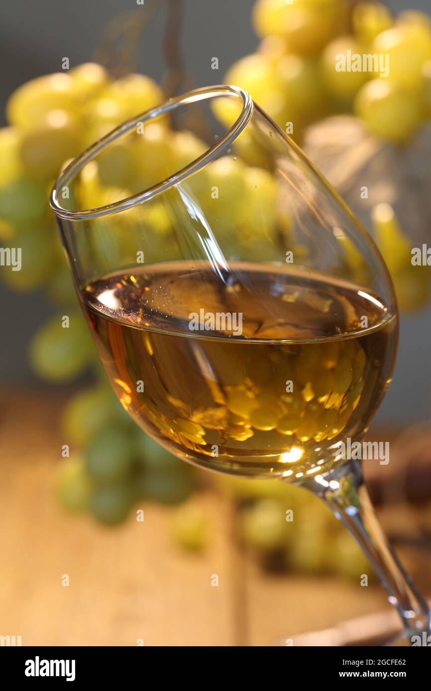 Glass of white wine in the vineyard Stock Photo - Alamy