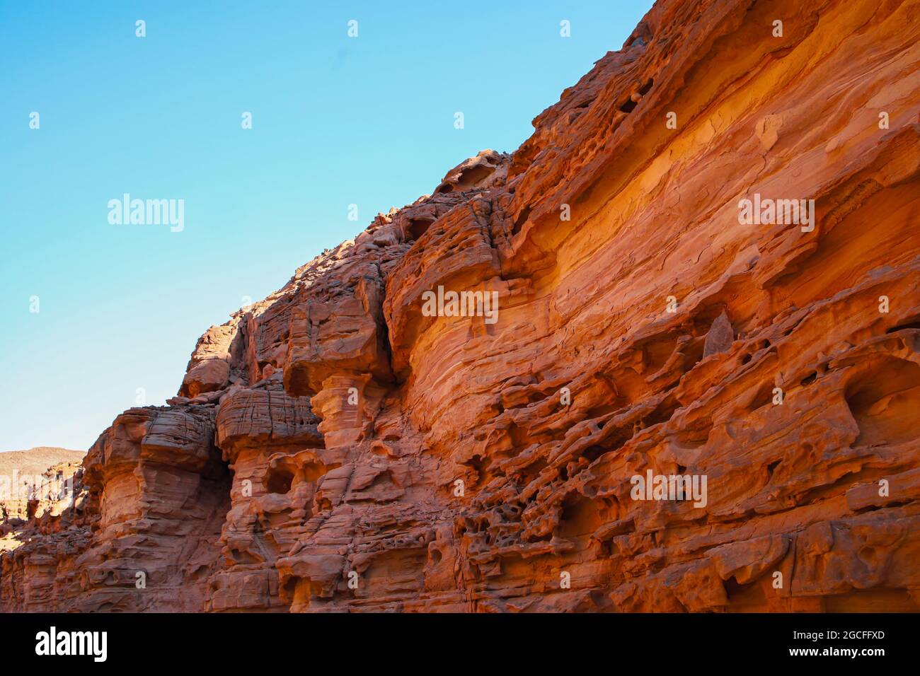 fascinating red stone cliffs in a deserted canyon Stock Photo - Alamy