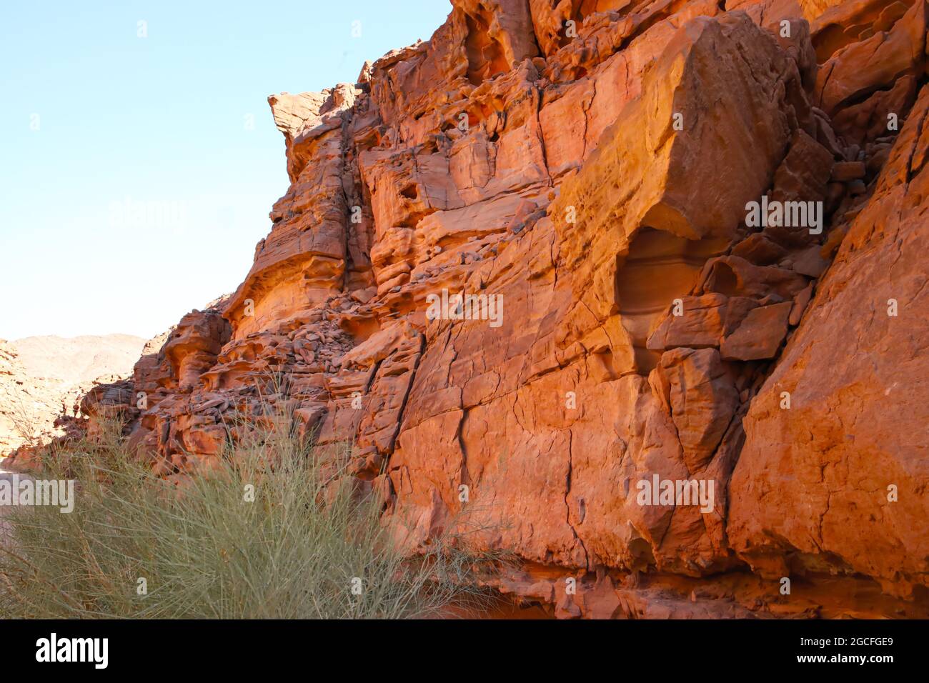 the mountain cliffs of the canyon are red against the blue sky Stock ...