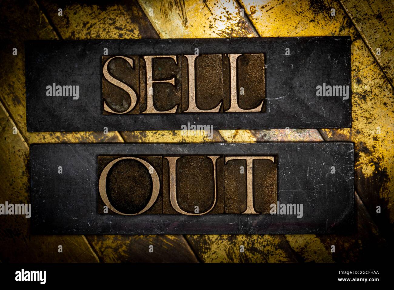 Sell Out text on vintage textured copper and gold background Stock ...
