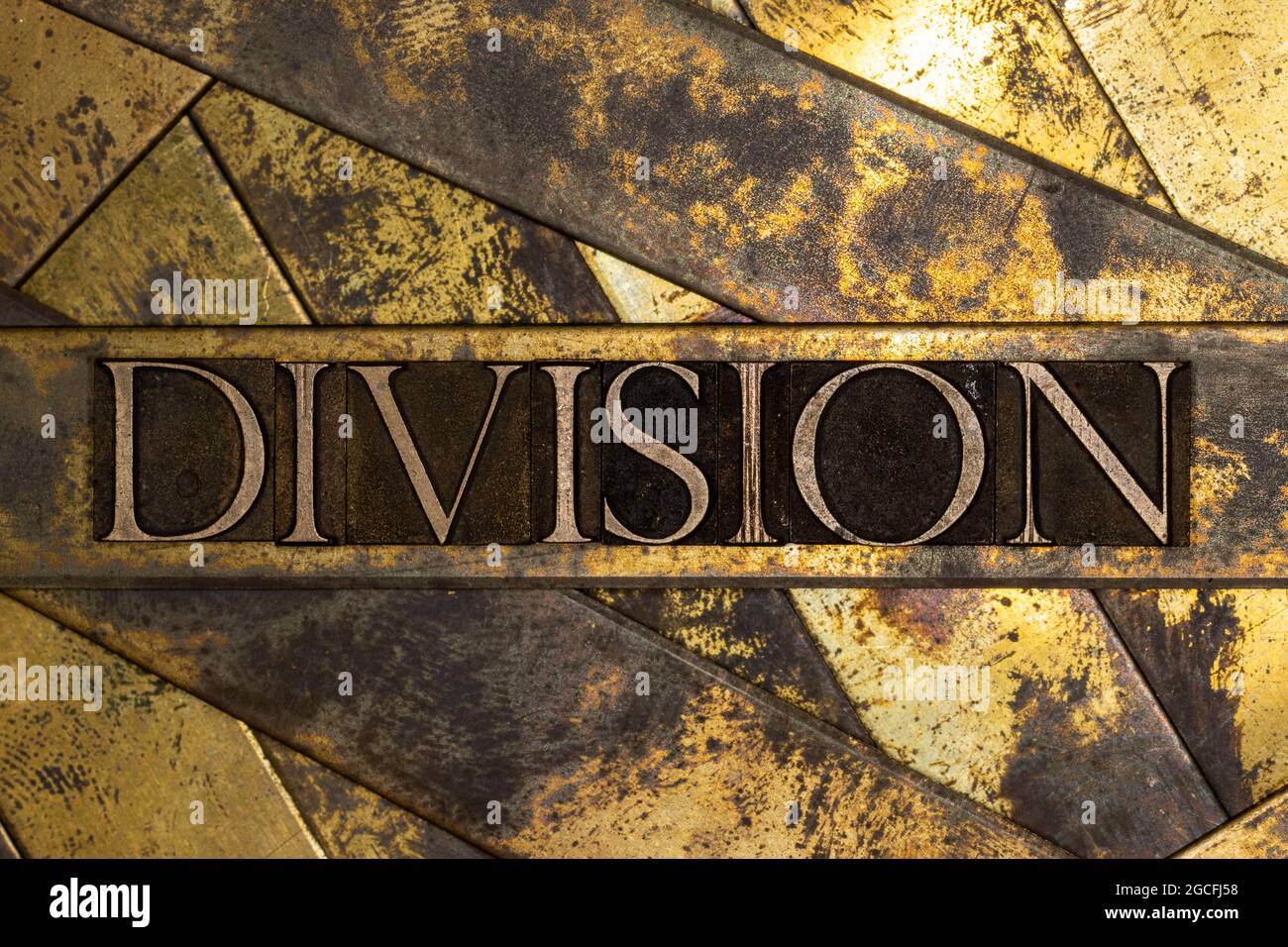 Division text on vintage textured silver grunge copper and gold ...