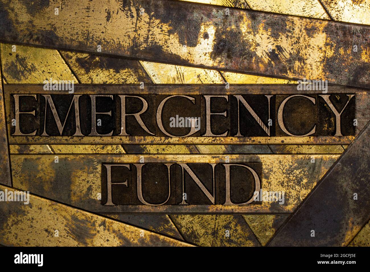 Emergency Fund text on vintage textured copper and gold background ...