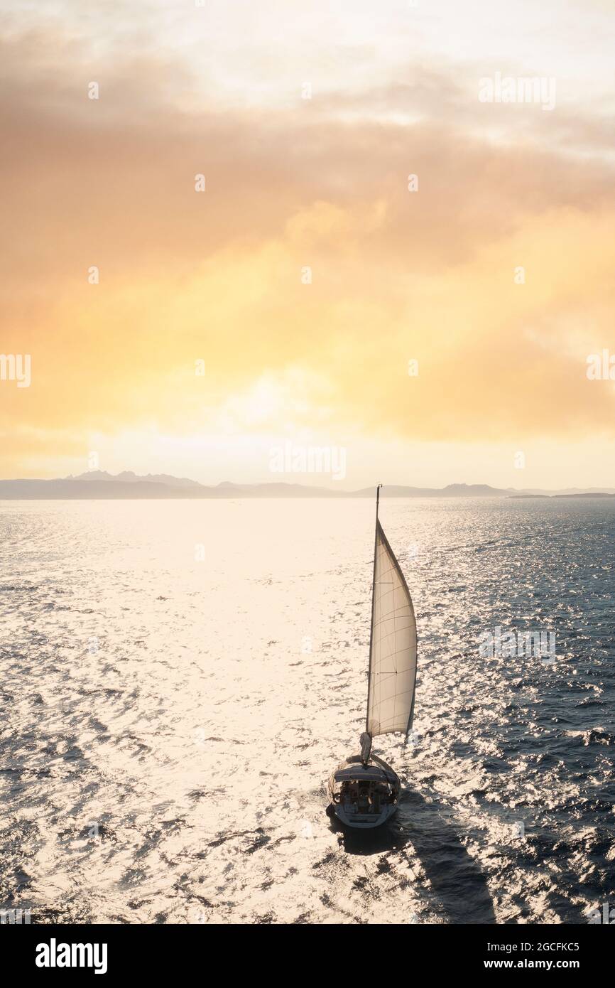 View from above, stunning aerial view of a sailboat sailing on a blue ...