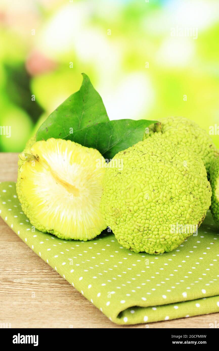 Osage Orange fruits (Maclura pomifera), on wooden table, on nature ...
