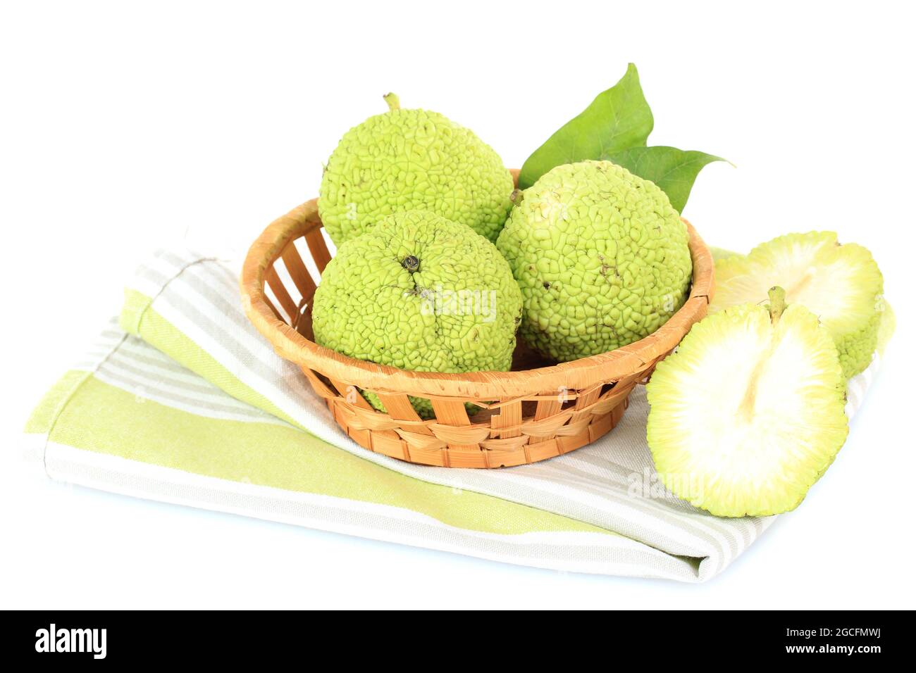 Osage Orange fruits (Maclura pomifera) in basket, isolated on white ...